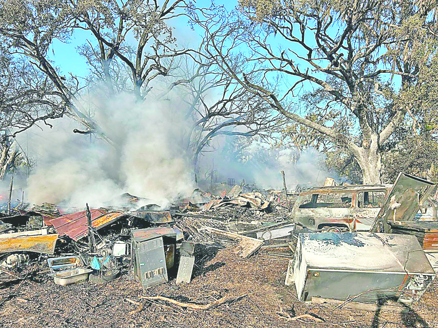 Escaped brush fire burns two structures